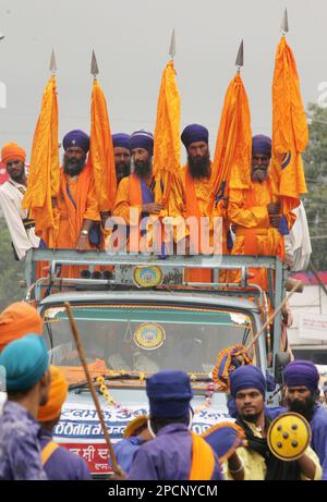 Five baptized Sikhs lead a religious procession outside the Golden ...