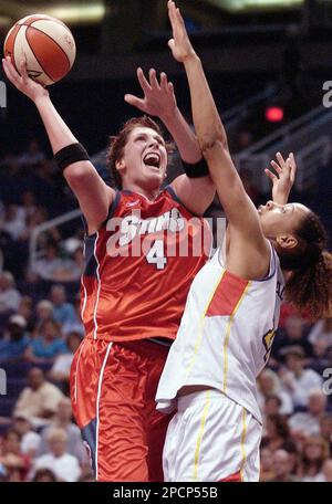 Phoenix Mercury forward Jennifer Lacy, left, gains control of a loose ...