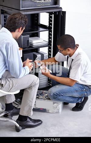 engineer installing electronic device at clients office Stock Photo - Alamy