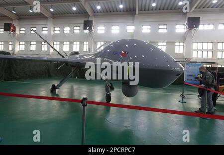 Visitors look at a Medium Altitude Long Endurance UAV drone at National ...