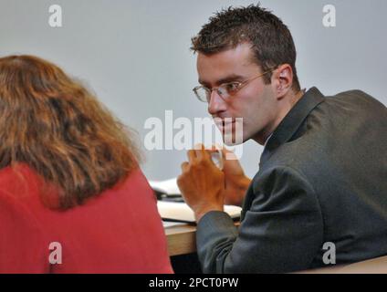 Christopher Porco, left in orange, listens as his aunt reads a ...