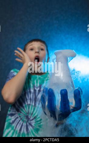 New scientific discoveries. Smart boy scientist screaming in surprise ...