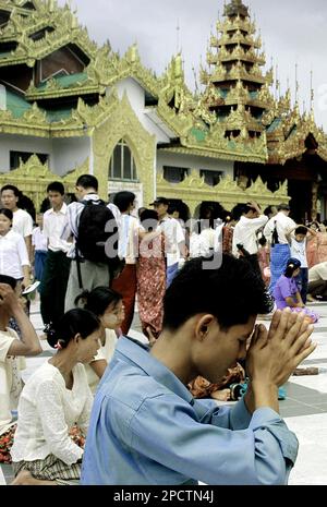 MYANMAR Shwedagon Pagoda, Yangon. Attending shrine Stock Photo - Alamy