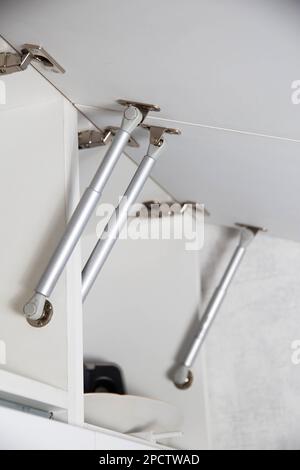 Retractable gas shock absorber for opening the drawer in the kitchen ...