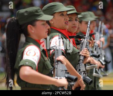 Venezuelan soldiers carrying Russian made AK-103 assault rifles march ...