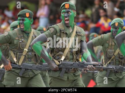 CARACAS, VENEZUELA - Soldiers march with rifles during July 5th ...