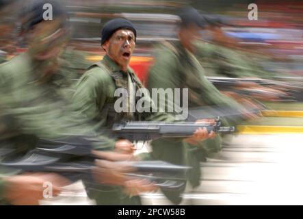 Venezuelan soldiers carrying Russian made AK-103 assault rifles march ...