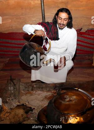 A Bedouin pouring tea in Wadi Rum Jordan Stock Photo - Alamy