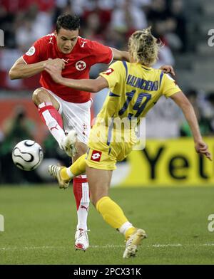 Switzerland's Philipp Degen, left, and Ukraine's Andriy Nesmachnyi ...