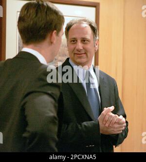 Mark Unger, left, talks with his defense attorney Robert Harrison ...