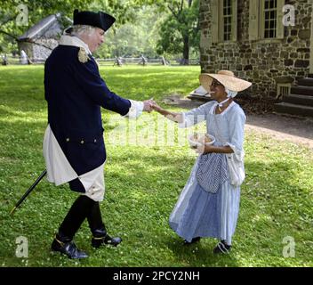 Dean Malissa, portraying George Washington stands in view of ...