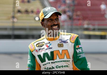 NASCAR driver Bill Lester smiles as he has his photo taked from his ...