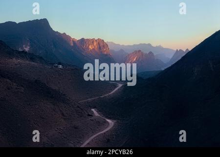 The wild road through Snake Canyon and Wadi Ban Auf at sunrise, Western ...