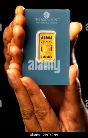 EDITORIAL USE ONLY A gold minted bullion bar depicting the Muslim holy ...