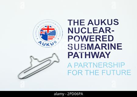 An AUKUS logo is seen on a press brochure at Parliament House in ...