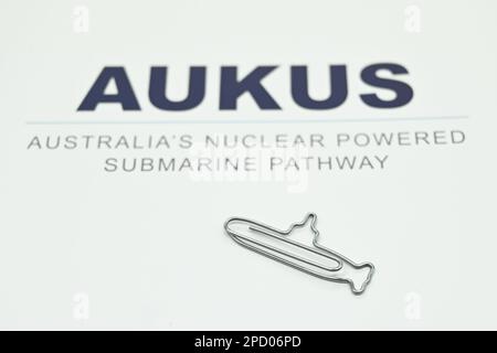An AUKUS logo is seen on a press brochure at Parliament House in ...