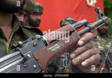 Indian army soldier with AK-47 gun standing in attention position Stock ...