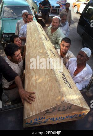 BAGHDAD, Iraq - A pickup truck loaded with Shiite Muslims in Baghdad ...