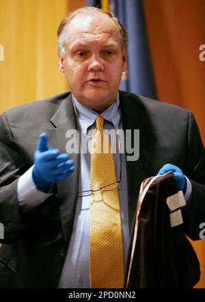 Defense witness Dr. Carl Schmidt explains the photos of tissue sample ...