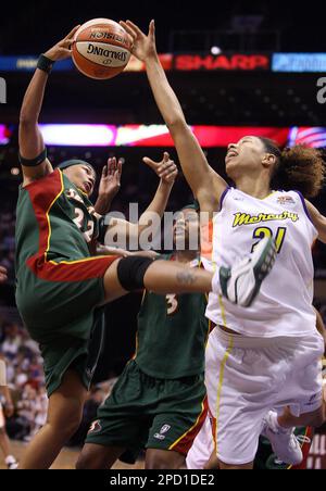 Phoenix Mercury forward Jennifer Lacy, left, gains control of a loose ...