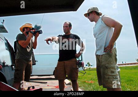 Sean Casey and the Tornado Intercept Vehicle 2 sits alongside a road ...