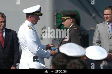 Srecko Herzeg, a descendant of WW2 hero Peter Tomich, salutes during ...