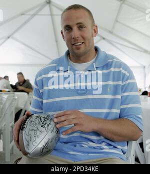 Oklahoma quarterback Jason White poses with his 2003 Heisman Trophy ...