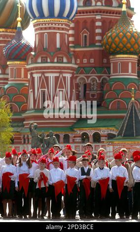Teenagers hold their red neckerchiefs, the visible symbols of the Young ...