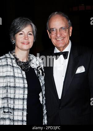 Senator George Mitchell and his wife Heather MacLachlan look at a newly ...