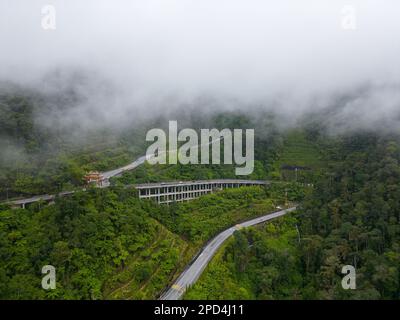 An aerial view of the Chin Swee Caves Temple and the surrounding trees ...