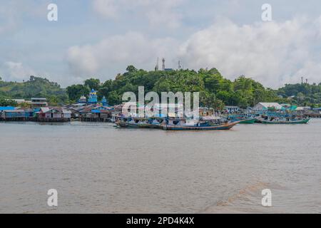 View from the ferry to Waisai at Sorong with cruises and tour boats ...