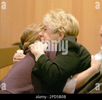 Melanie Jensen-Doehring, left, wife of Michigan State Police Trooper ...