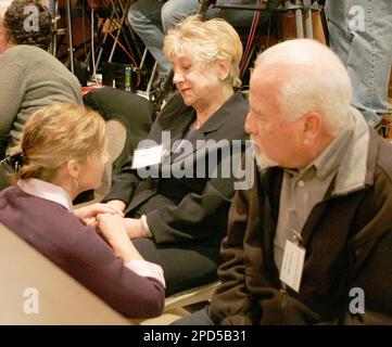 Melanie Jensen-Doehring, left, wife of Michigan State Police Trooper ...