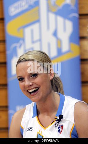Chicago Sky forward Stacey Dales, right, drives against Phoenix Mercury center Kelly Schumaker ...