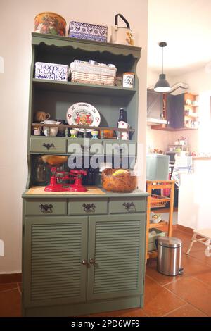 Traditional Hungarian kitchen dresser, kitchen behind, in a peasant ...