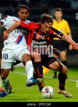 Lyon's French midfielder Florent Malouda, right, and Florent Balmont of ...