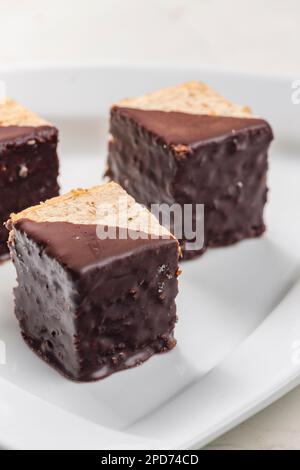 nutty sponge cakes with chocolate coating Stock Photo - Alamy