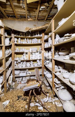 Dozens of unpainted ceramic figurines on shelves Stock Photo - Alamy