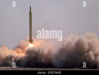 Iran's elite Revolutionary Guards tests missiles during maneuvers in a ...