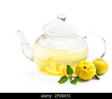 Hot quince tea in transparent teapot with fresh fruits isolated on ...
