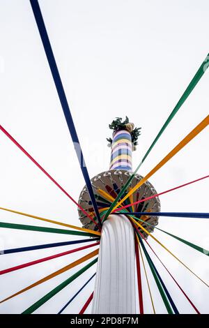 Brightly coloured ribbons of a traditional English maypole used for ...