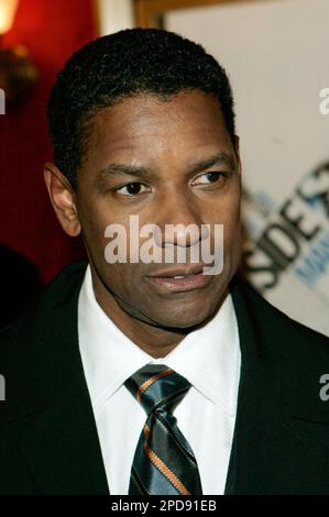 Denzel Washington poses for photographers during red-carpet arrivals to ...