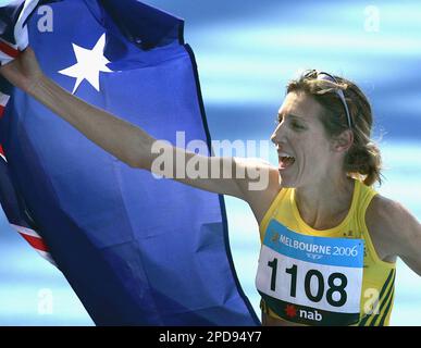 Australia's Kerryn McCann reacts after winning the gold medal in the ...