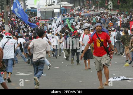 Protesters flee as riot police disperse them when they tried to march ...