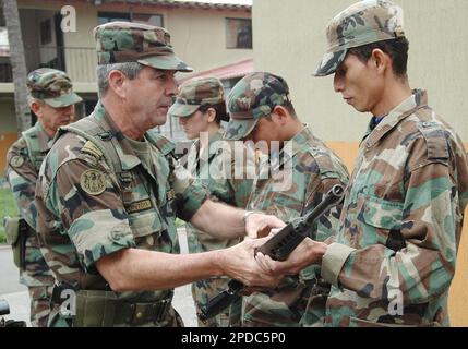 Fighters of the National Liberation Army, ELN, line up during a ...