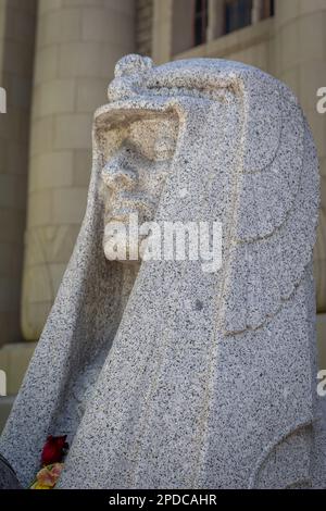 Granite statue of a sphinx holding an orb at a Masonic temple Stock ...