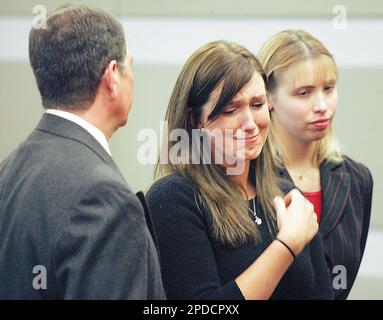 Jessica Coleman, center, reacts with her attorneys' Jack Bradley, left ...