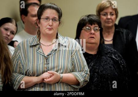 Trena Gage, left, mother of Jetseta Gage, 10, wipes away tears while ...