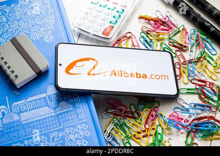 In this photo illustration, an Alibaba logo is seen displayed on a ...