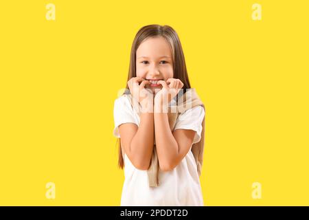 Little girl biting nails on white background Stock Photo - Alamy